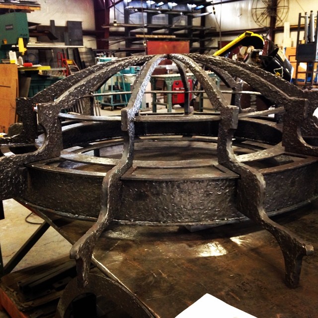 This massive wrought iron chandelier is a work in progress in the ...
